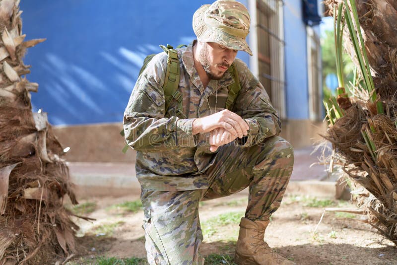 Young Hispanic Man Wearing Soldier Uniform Looking Watch at Park Stock ...