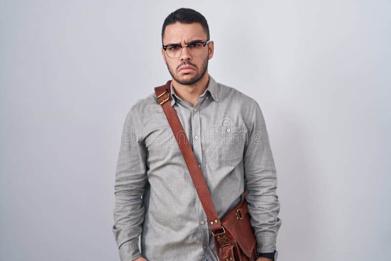 Young Hispanic Man Wearing Suitcase Depressed and Worry for Distress ...