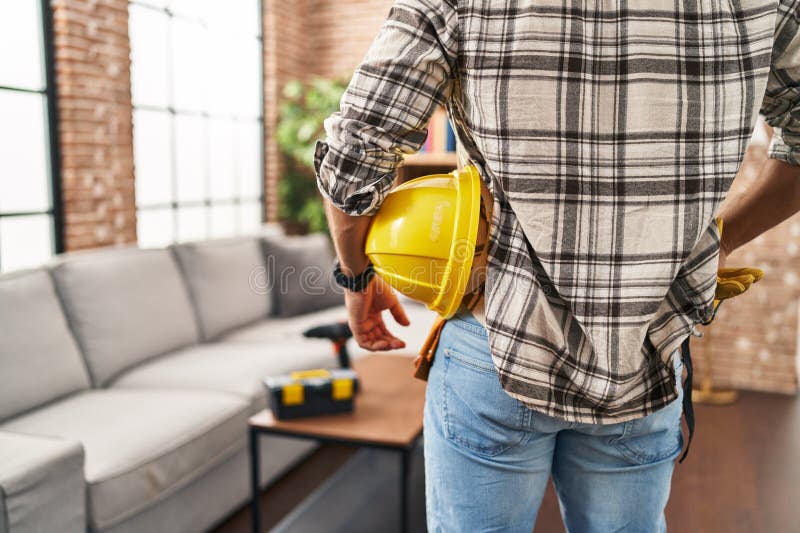 Young Hispanic Man Worker Standing on Back View at Home Stock Photo ...
