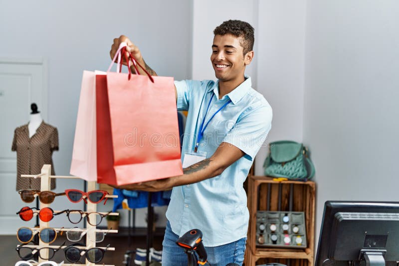 Young Hispanic Man Working As Shop Assistant at Retail Shop Stock Image ...