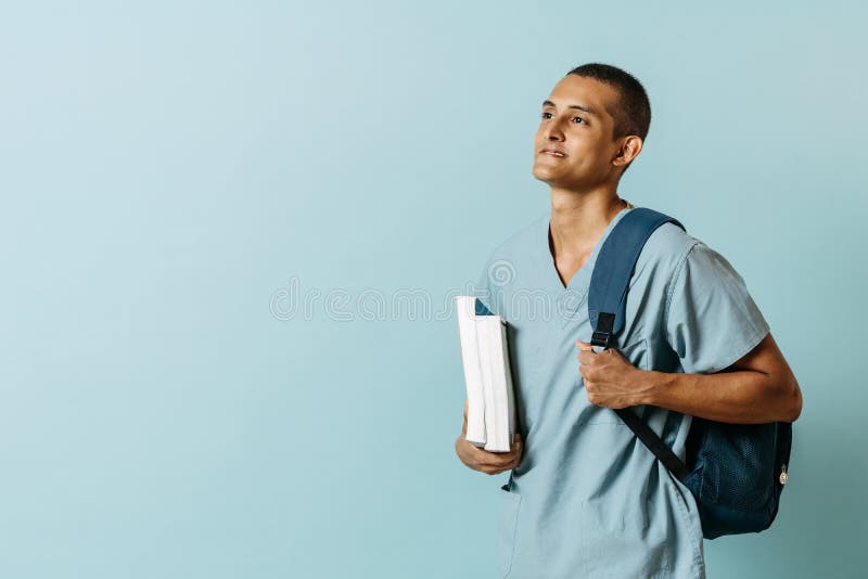 Young Hispanic Medical Student Isolated on the Blue Background. Stock ...