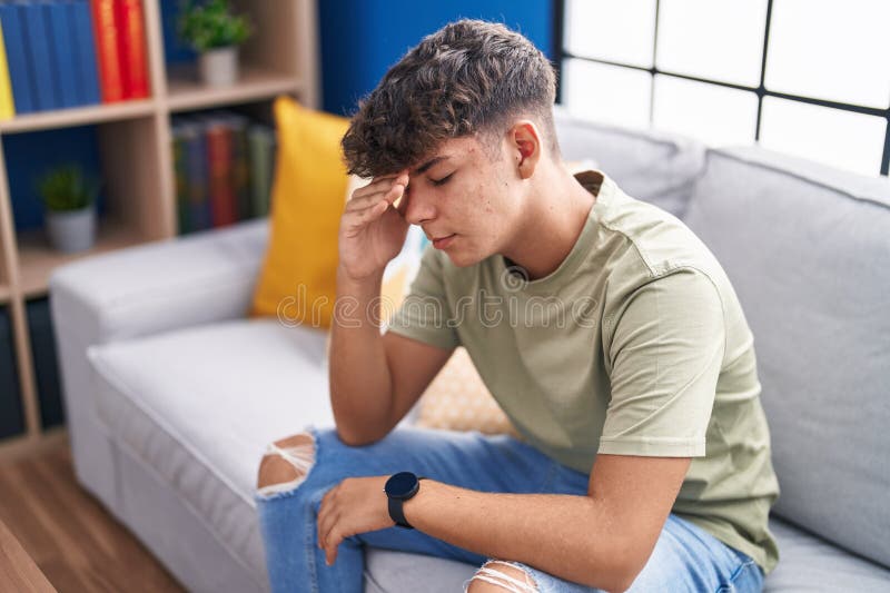 Young Hispanic Teenager Stressed Sitting on Sofa at Home Stock Image ...