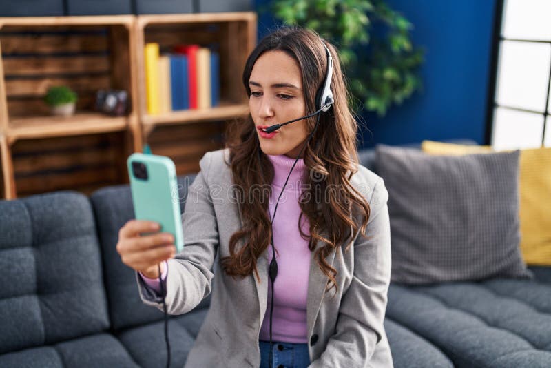 Young Hispanic Woman Call Center Agent Working Sitting on Sofa at Home ...