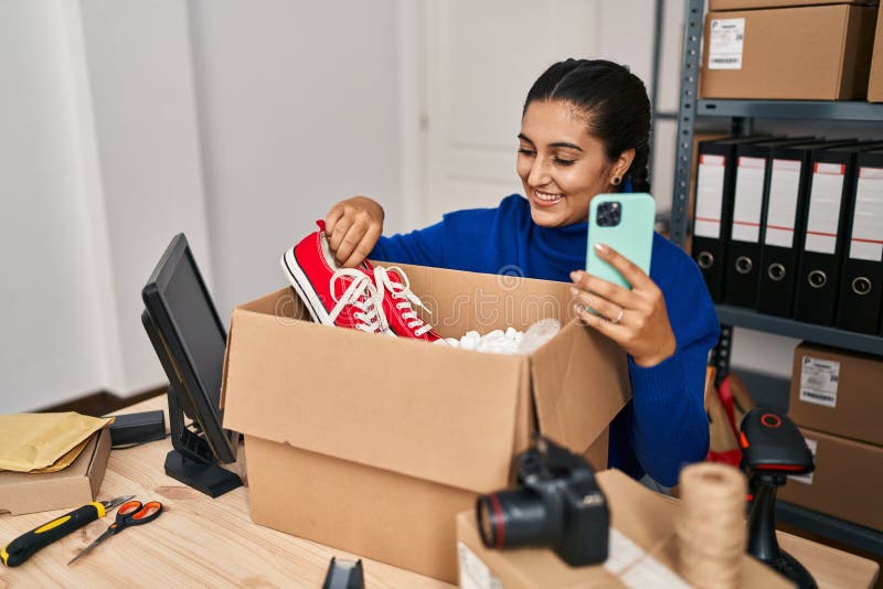 Young Hispanic Woman Ecommerce Business Worker Prepare Order Package at ...