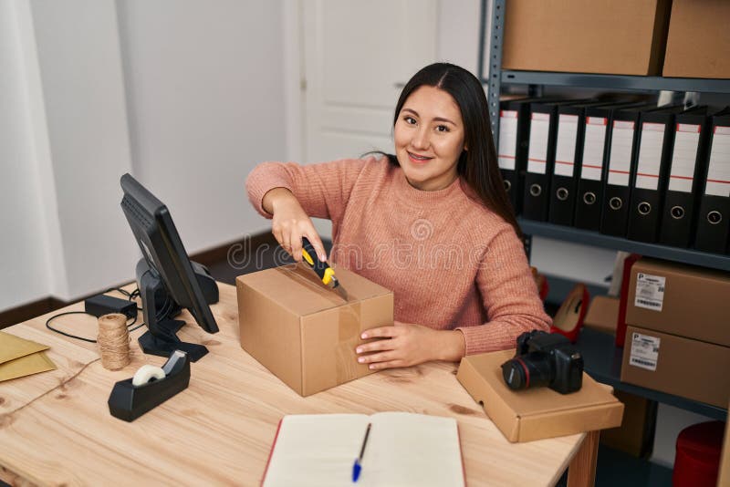 Young Hispanic Woman Ecommerce Business Worker Unpacking Cardboard Box ...