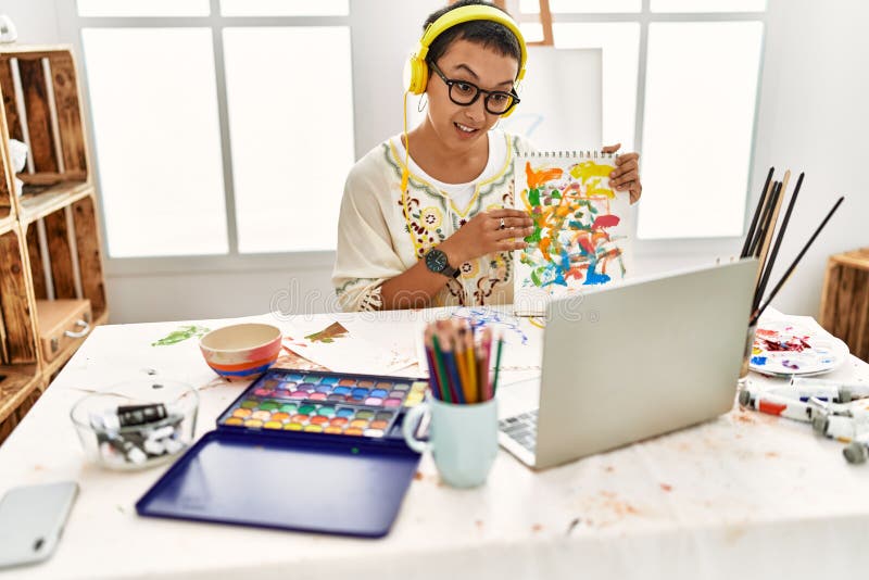 Young Hispanic Woman Having Online Draw Lesson at Art Studio Stock ...