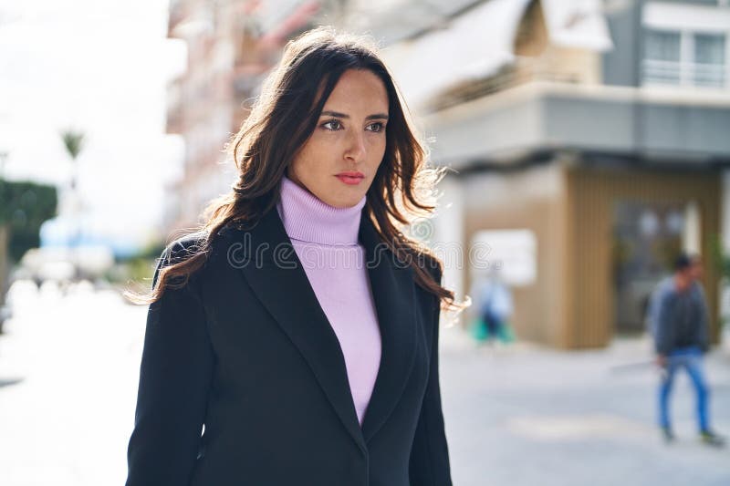 Young Hispanic Woman with Relaxed Expression Standing at Street Stock ...