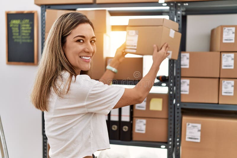 Young Hispanic Woman Smiling Confident Working at Store Stock Image ...