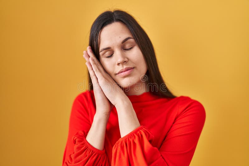 Young Hispanic Woman Standing Over Yellow Background Sleeping Tired ... Young Hispanic Woman Standing Over Yellow Background Sleeping Tired ...