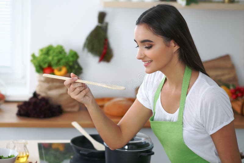 Young Hispanic Woman or Student Cooking in Kitchen Stock Image - Image ...