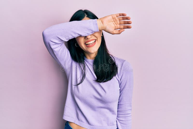 Young Hispanic Woman Wearing Casual Clothes Covering Eyes With Arm