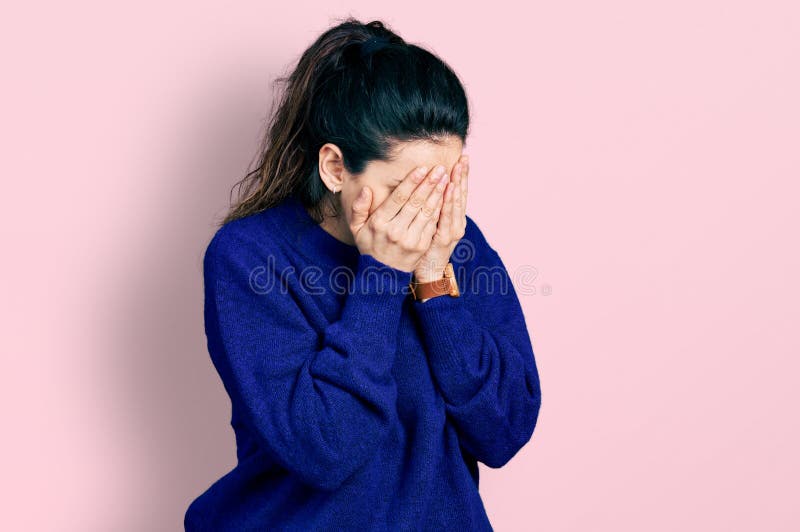 Young Hispanic Woman Wearing Casual Clothes With Sad Expression