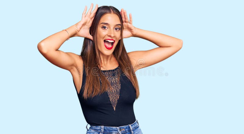 Young Hispanic Woman Wearing Casual Clothes Smiling Cheerful Playing
