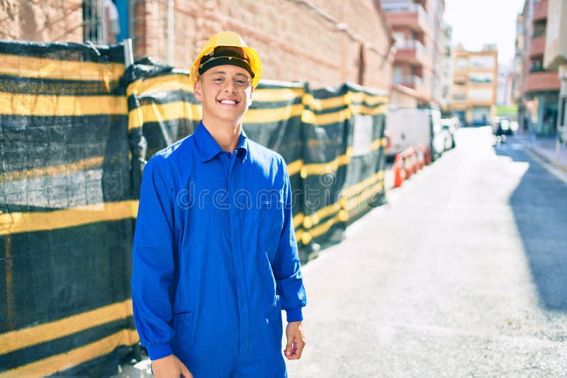 Young Hispanic Workman Smiling Happy Working at Street of City Stock ...