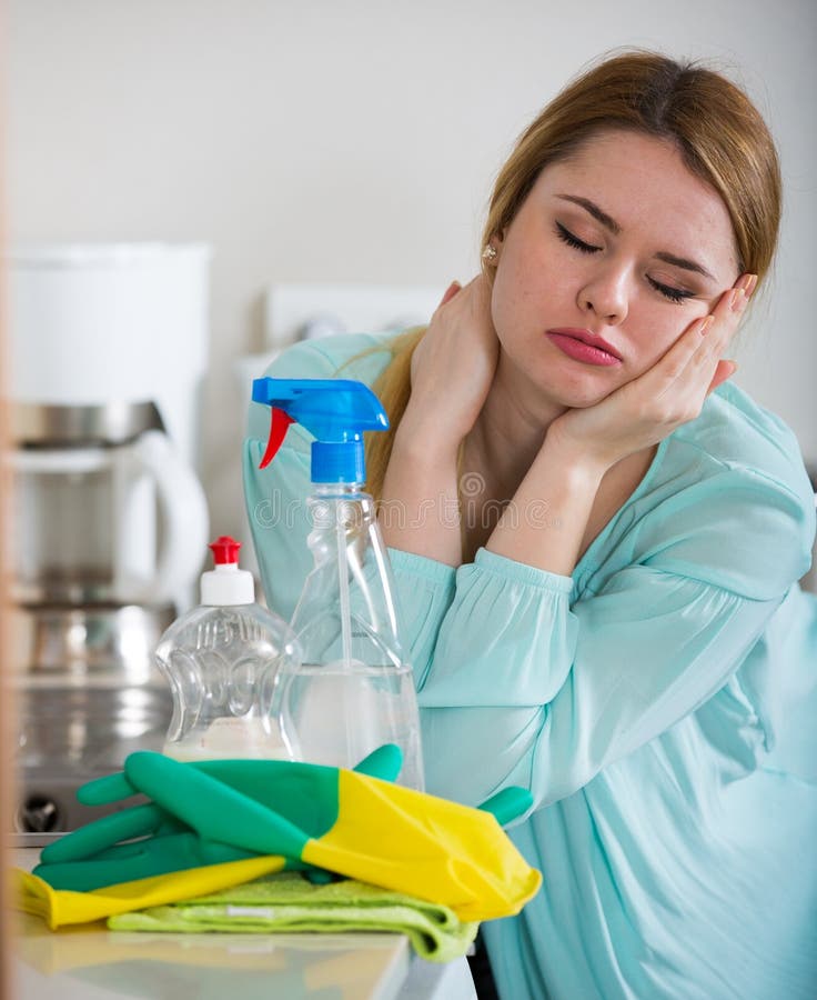 Young Housewife Tired Dusting In Domestic Kitchen Stock Image Image