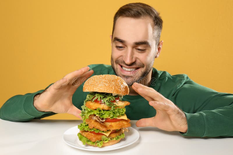 Young Hungry Man Eating Huge Burger Stock Photo - Image of foodstuff ...