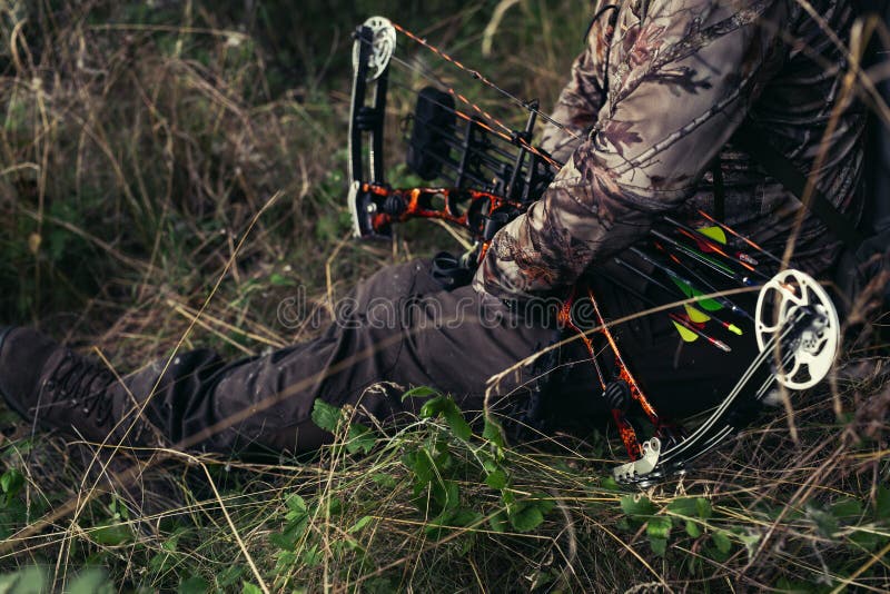 Hunter in the Woods with Bow and Arrow Ready To Take Aim at His Prey ...