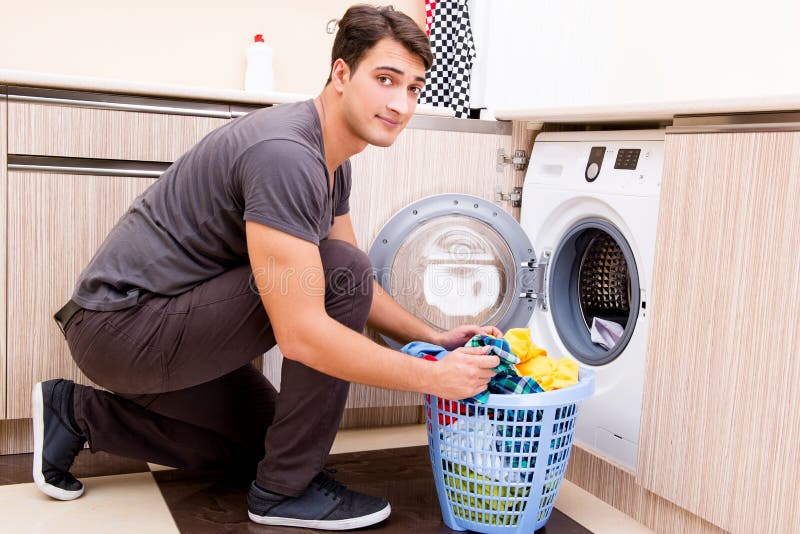 The Young Husband Man Doing Laundry at Home Stock Photo - Image of ...