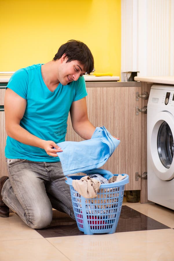 The Young Husband Man Doing Laundry at Home Stock Photo - Image of ...