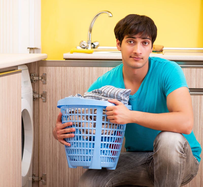 Young Husband Man Doing Laundry at Home Stock Photo - Image of ...