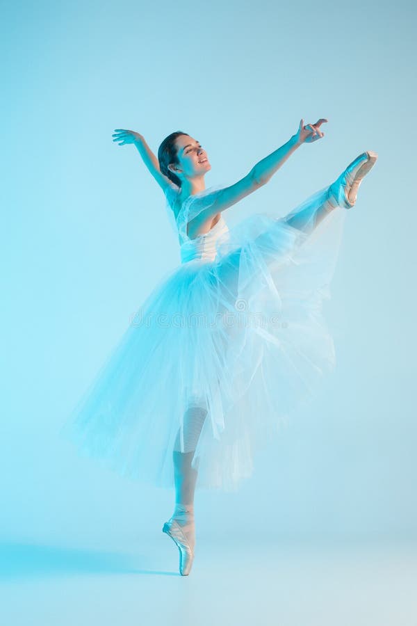 Young and Incredibly Beautiful Ballerina is Dancing in a Blue Studio ...