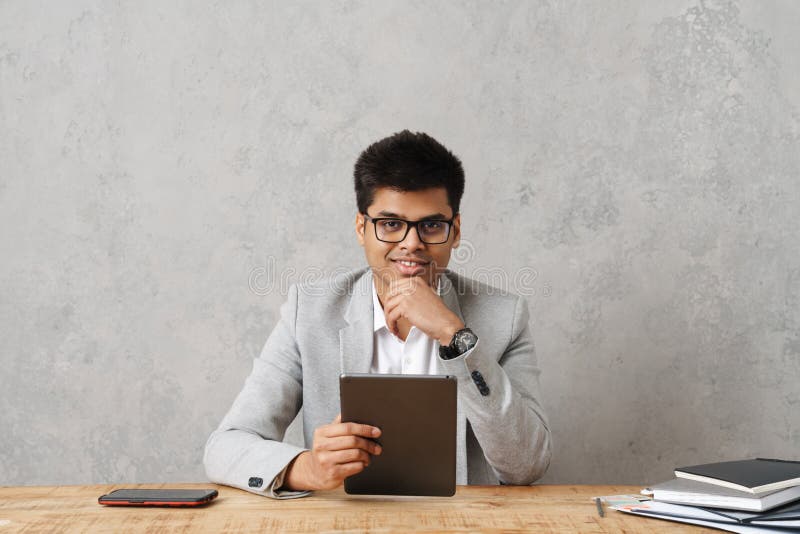 Young Indian Businessman Using Tablet Computer in Office Stock Photo ...