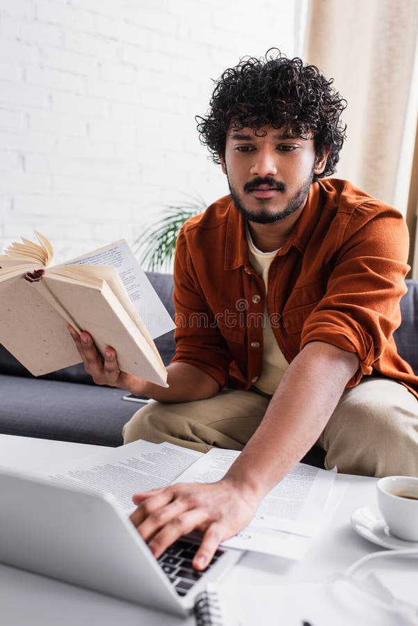 Young Indian Copywriter Holding Book and Stock Photo - Image of ...