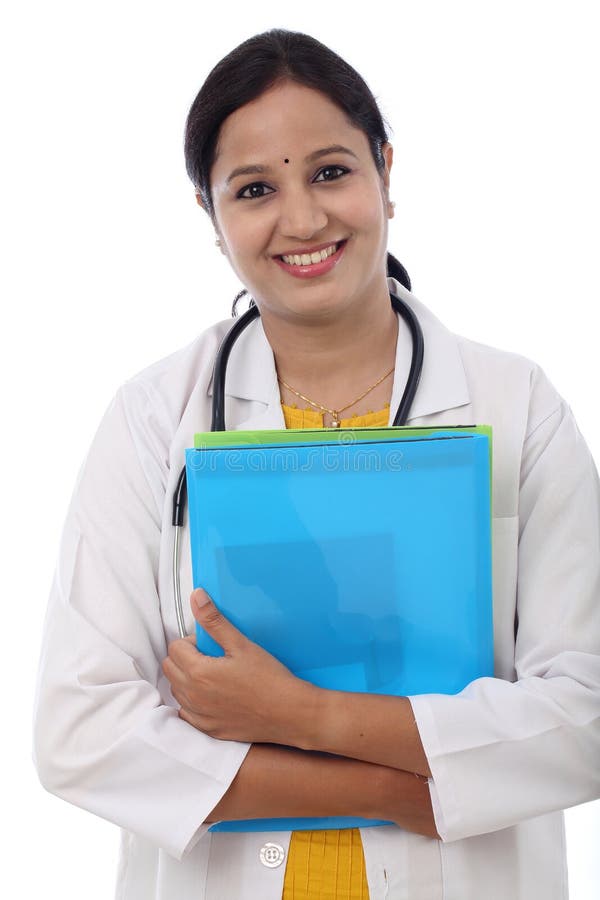 Young Indian Traditional Femal Doctor Texting at Her Desk Stock Photo ...