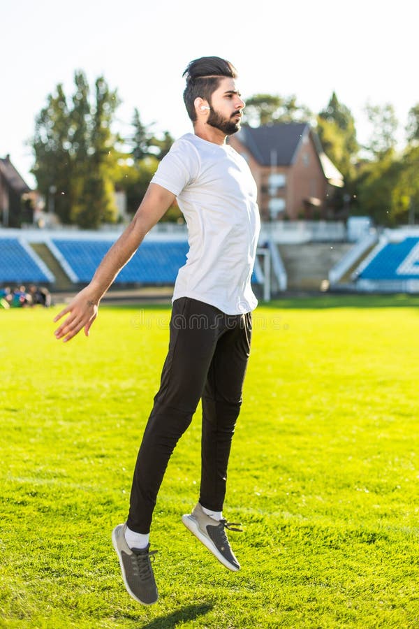 Young Indian Handsome Man Jumping at the Stadium Stock Photo - Image of ...