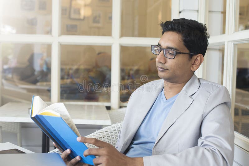 Young indian male reading stock image. Image of diploma - 63394531