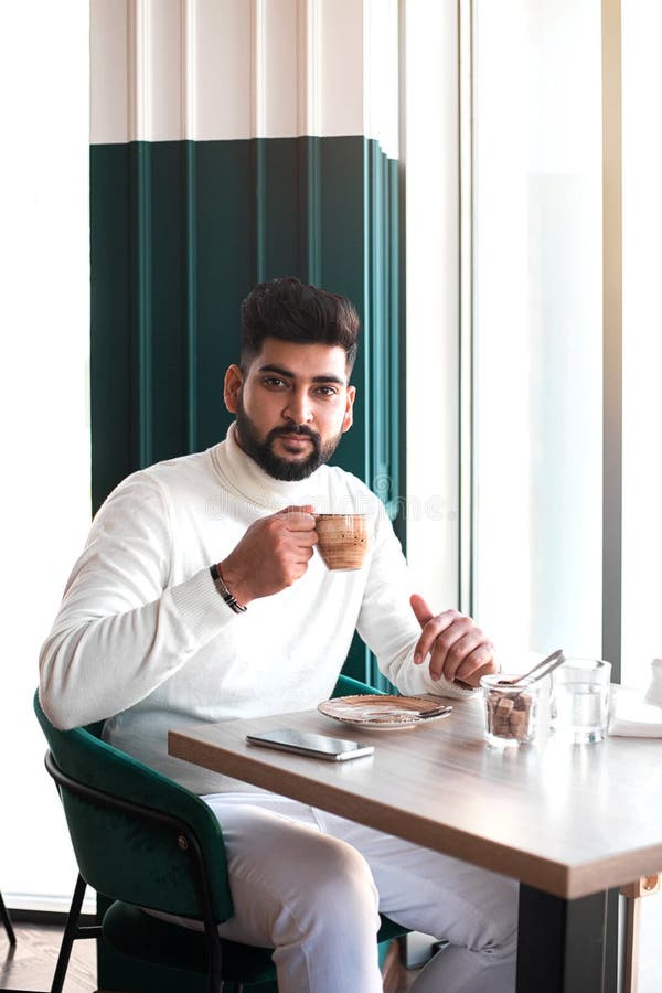 Young Indian Man Drinking Coffee in Cafe. Stock Photo - Image of ...
