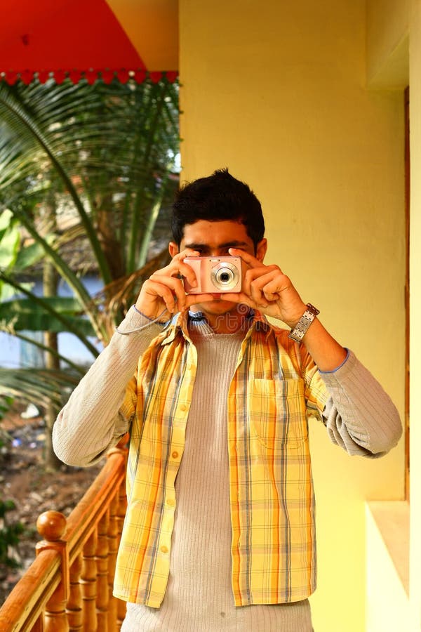 Young Indian Man Taking Photograph in P&S Camera Stock Image - Image of ...