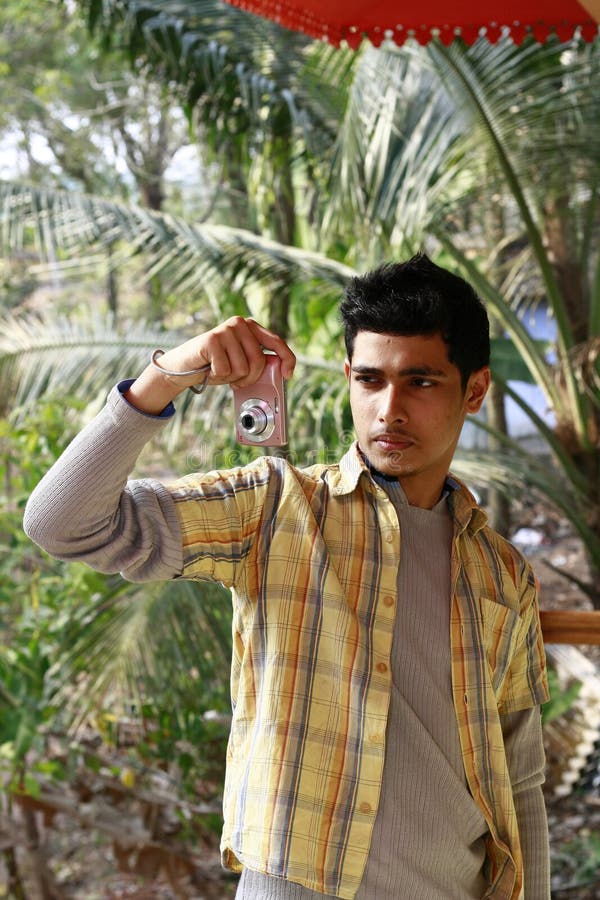 Young Indian Man Taking Photograph in P&S Camera Stock Image - Image of ...