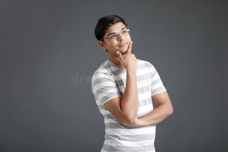 Young Indian man thinking stock image. Image of person - 145090313