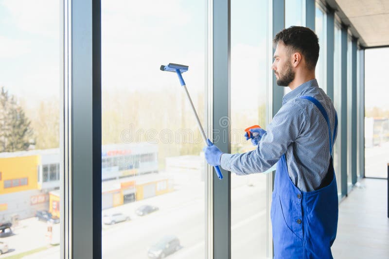 Young Indian Man Washing Window in Office Stock Image - Image of male ...