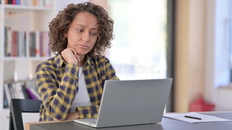 Young Indian Woman with Laptop Thinking at Work Stock Image - Image of ...