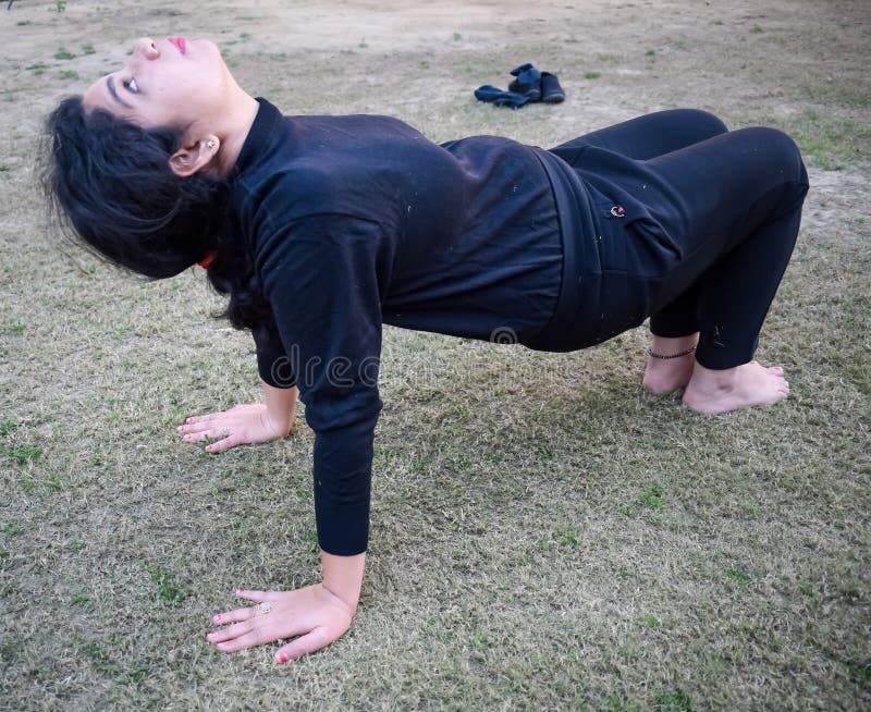 Young Indian Woman Practicing Yoga Outdoor In A Park Beautiful Girl