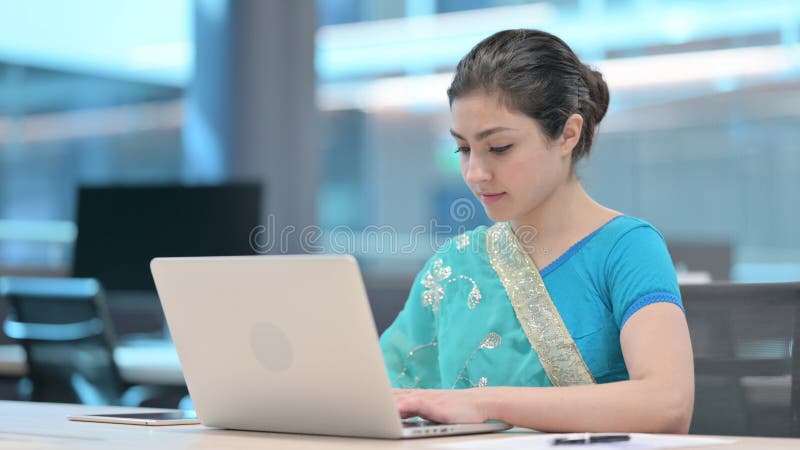 Young Indian Woman Working on Laptop in Office Stock Photo - Image of ...