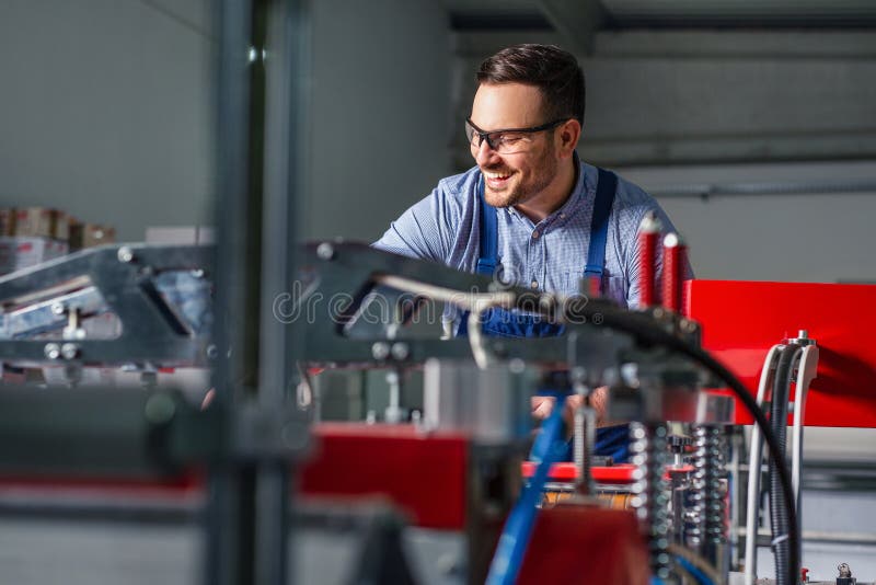 Industrial Machine Operator Working in Factory. Stock Photo - Image of ...