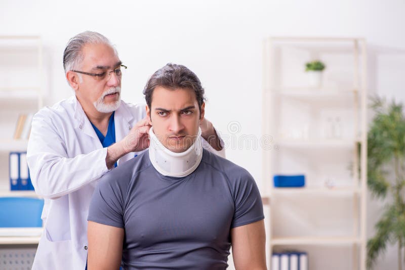 Young Injured Boxer Visiting Old Doctor Traumatologist Stock Image ...