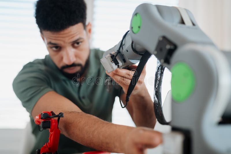 Young Innovator Developing Robotic Arm As Part of Home Tech Project ...