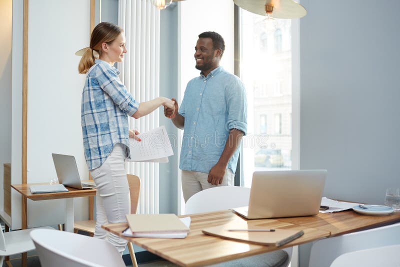 Deal in office stock image. Image of intercultural, colleagues - 109664251