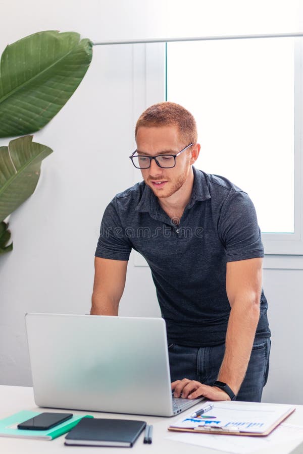 Young Investor Man Standing and Looking at Computer Smiling Stock Image ...