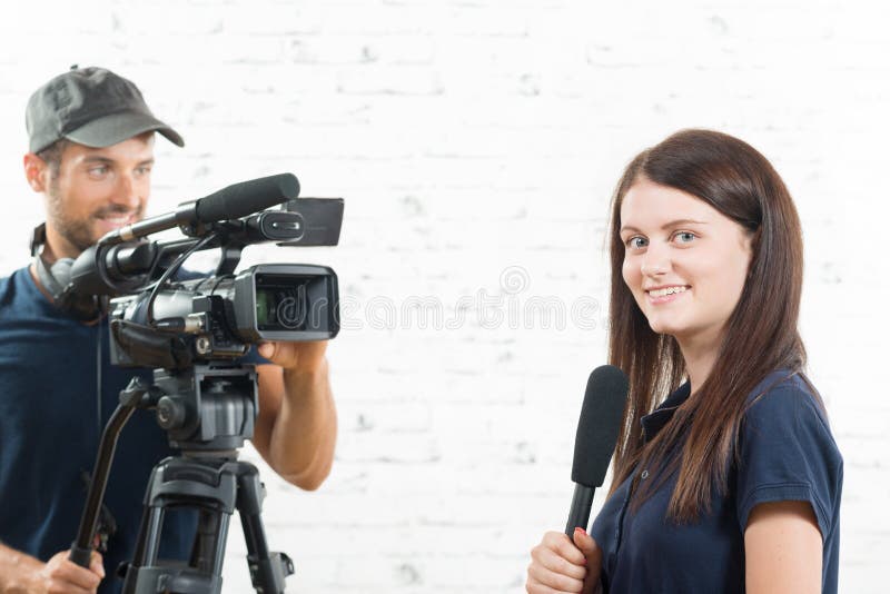 A Young Journalist and a Cameraman Stock Image - Image of interviewing ...