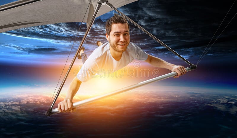 Young Man Flying on Hang Glider. Mixed Media Stock Image - Image of ...