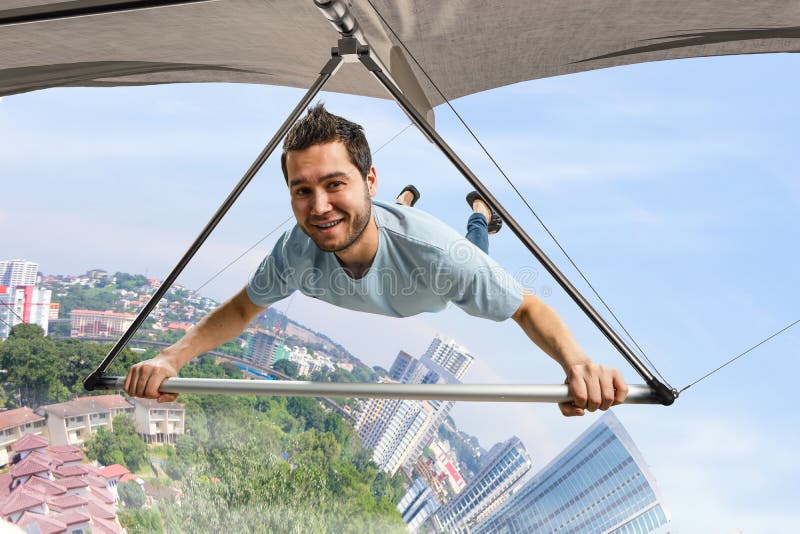 Young Man Flying on Hang Glider. Mixed Media Stock Photo - Image of ...