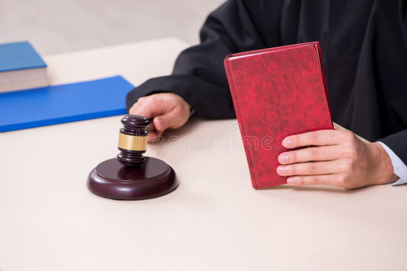 Young Male Judge Working in Courthouse Stock Photo - Image of code ...