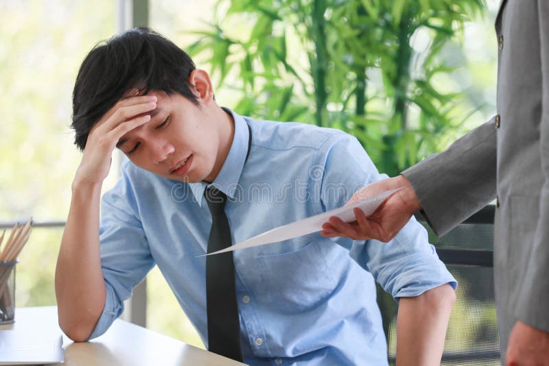 A Young Junior Employee Feels Headache when the Boss Abuses Him about ...