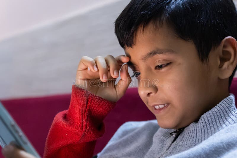 Young Kid Facial Expression while Watching Mobile and Playing Online ...