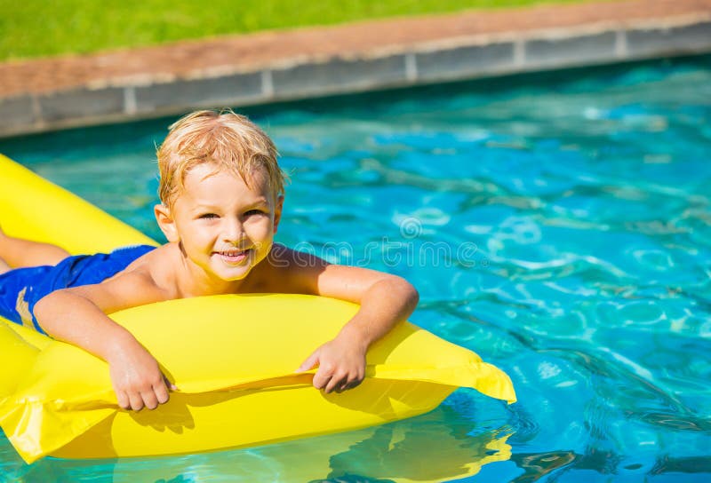 Boy Relaxing and Having Fun in Swimming Pool on Yellow Raft Stock Image ...